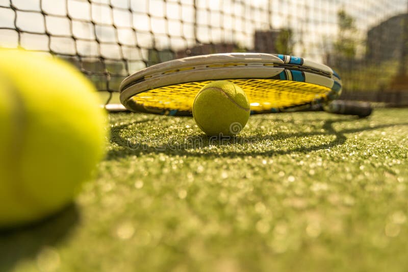 Tennis Racket with a Tennis Ball on a Tennis Court Stock Photo - Image ...
