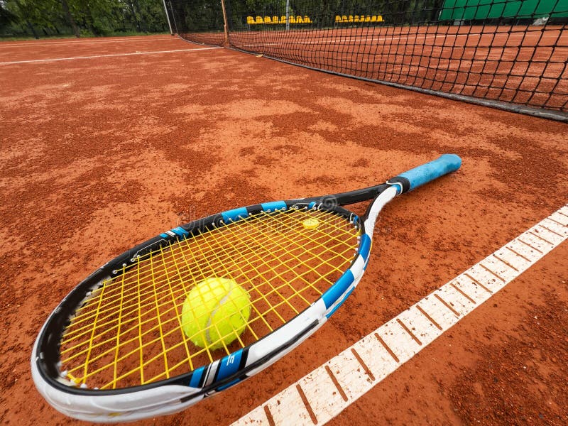 Tennis Racket with a Tennis Ball on a Tennis Court Stock Image - Image ...