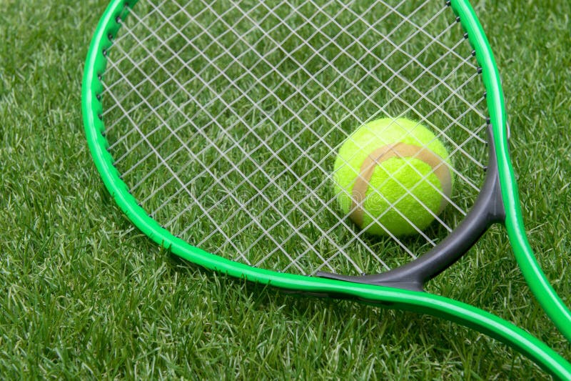 Tennis Racket and Ball on Green Grass Stock Photo - Image of court ...