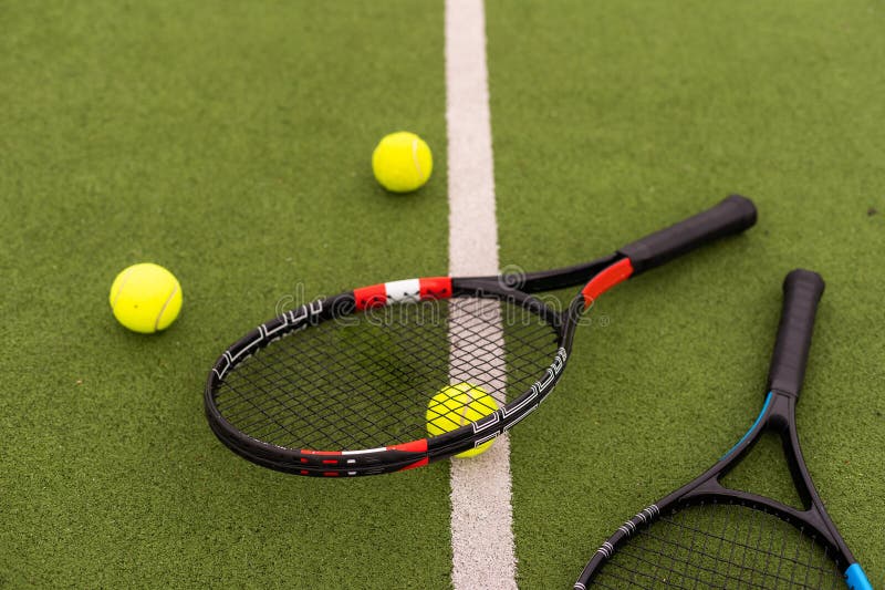 Tennis Racket with Balls on Green Background. Stock Photo - Image of ...
