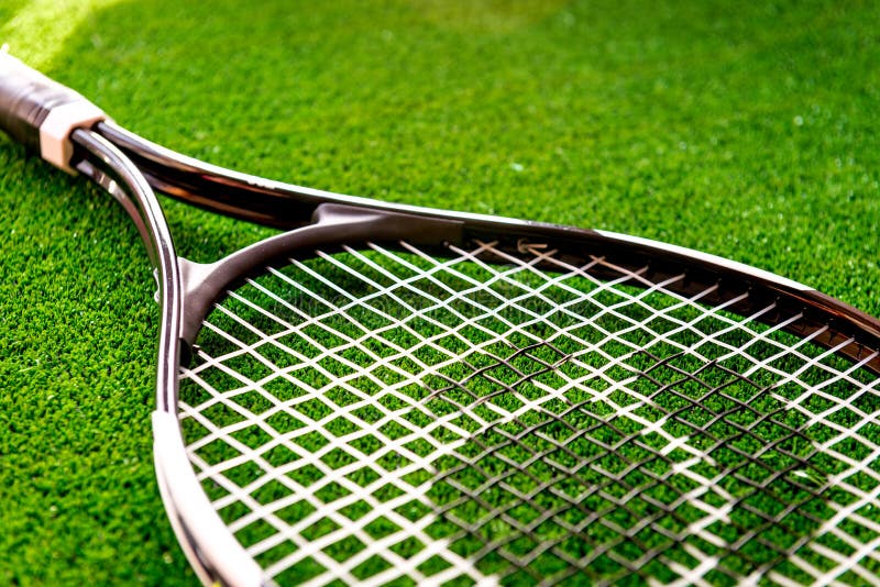 Tennis Racket on Green Background Close Up Stock Image - Image of drop ...