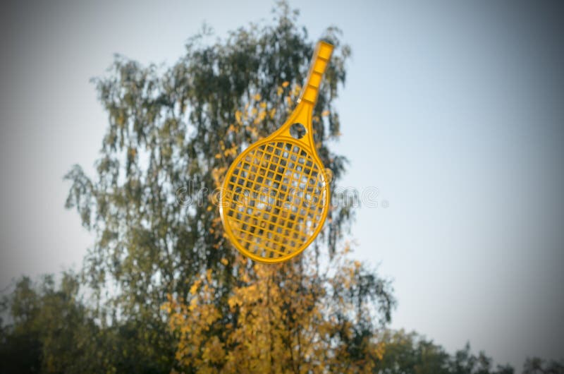 A Tennis Racket in His Hand Catches the Ball in Motion. Stock Photo ...