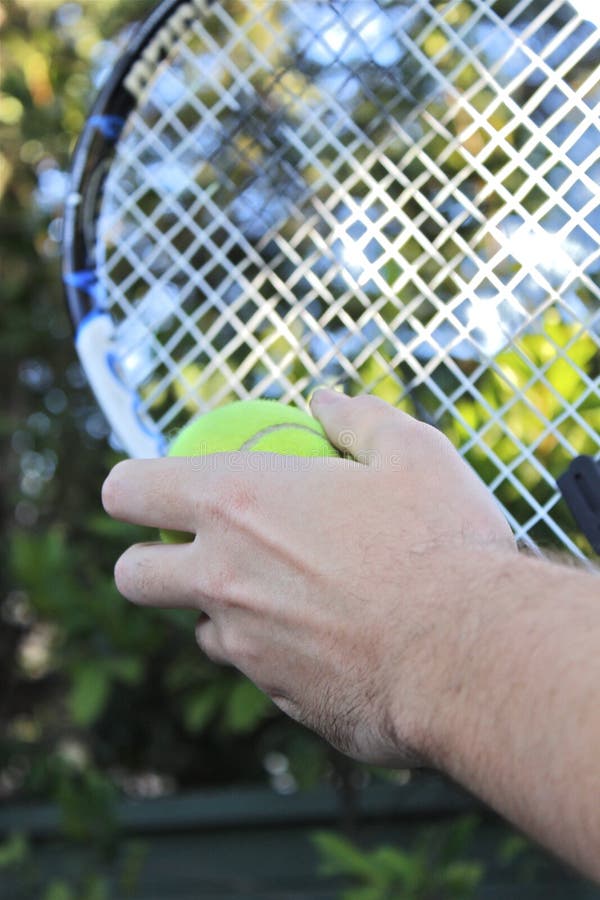 Tennis Racquet and Ball in Hands Stock Image - Image of outdoors, court ...