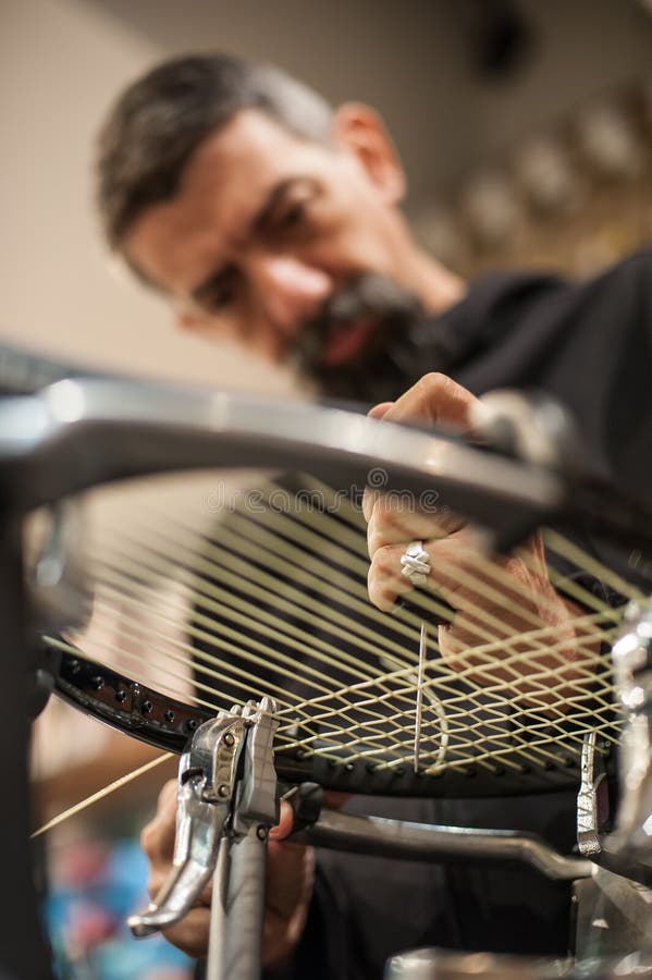 Tennis Stringer Holding Awl and Doing Racket Stringing Stock Image ...