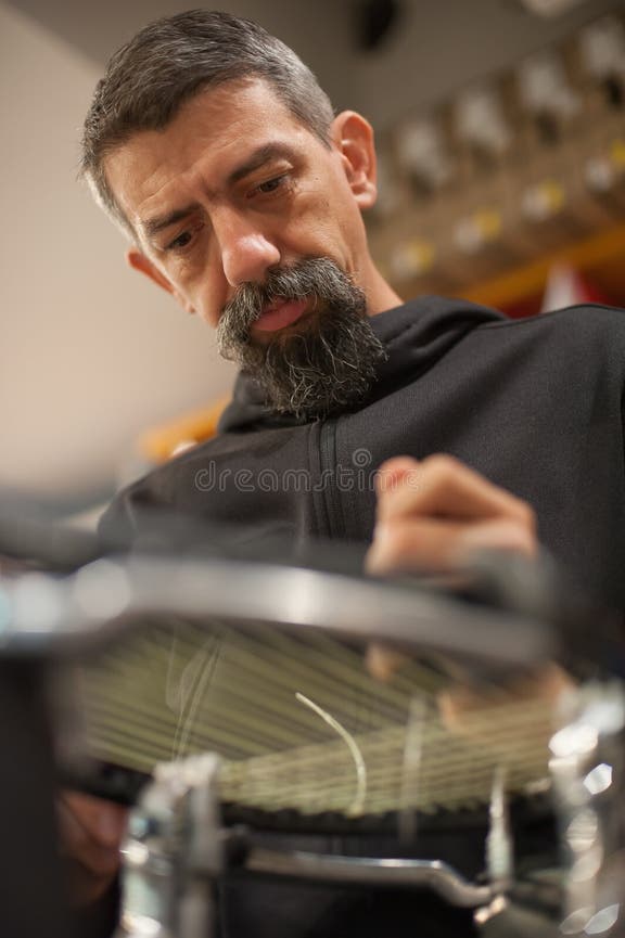 Tennis Stringer Holding Awl and Doing Racket Stringing Stock Photo ...