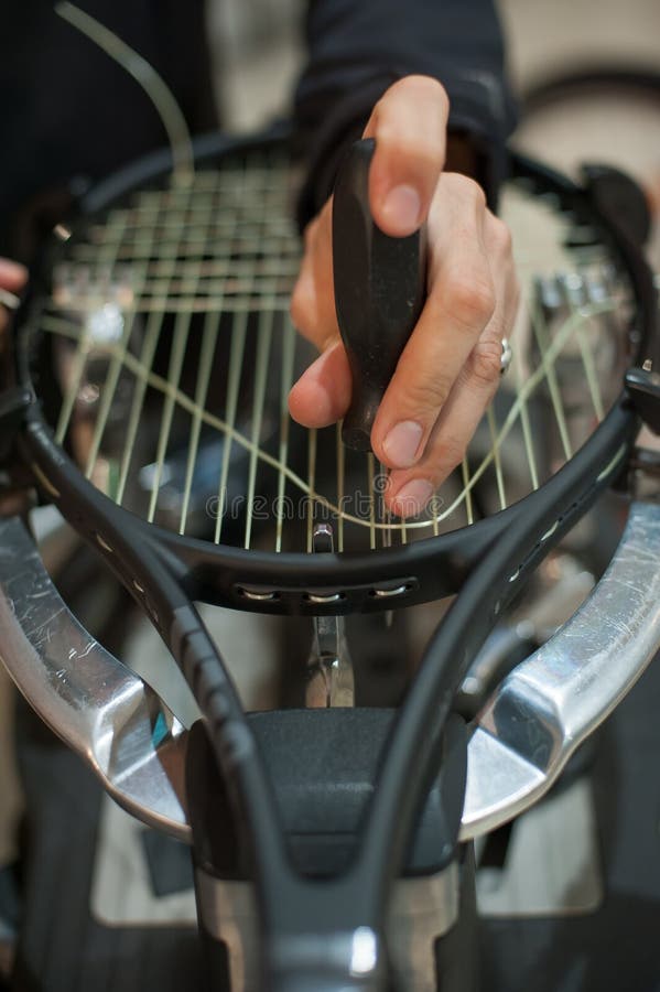 Tennis Stringer Holding Awl and Doing Racket Stringing Stock Photo ...