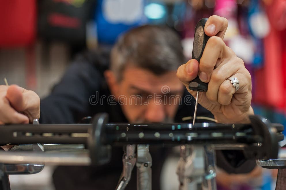 Tennis Stringer Holding Awl and Doing Racket Stringing Stock Image ...