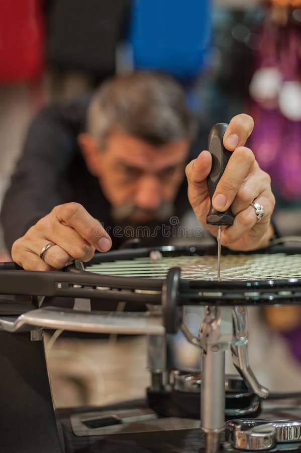 Tennis Stringer Holding Awl and Doing Racket Stringing Stock Image ...