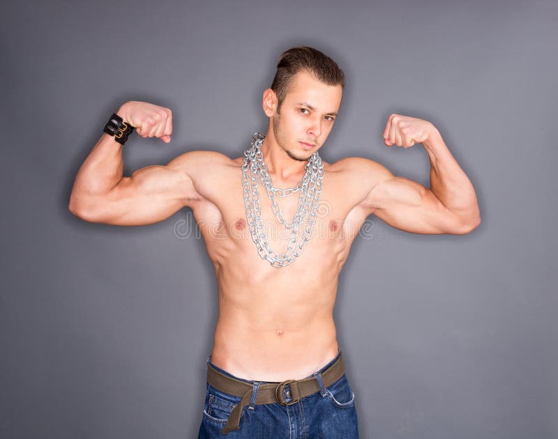 Tense Man with Chains Around Neck Stock Photo - Image of abdominal ...