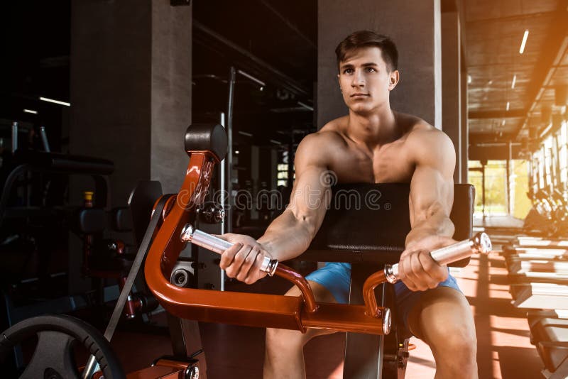 Tense Muscles of Hands Under Load. Man Doing Exercise for Biceps in the ...