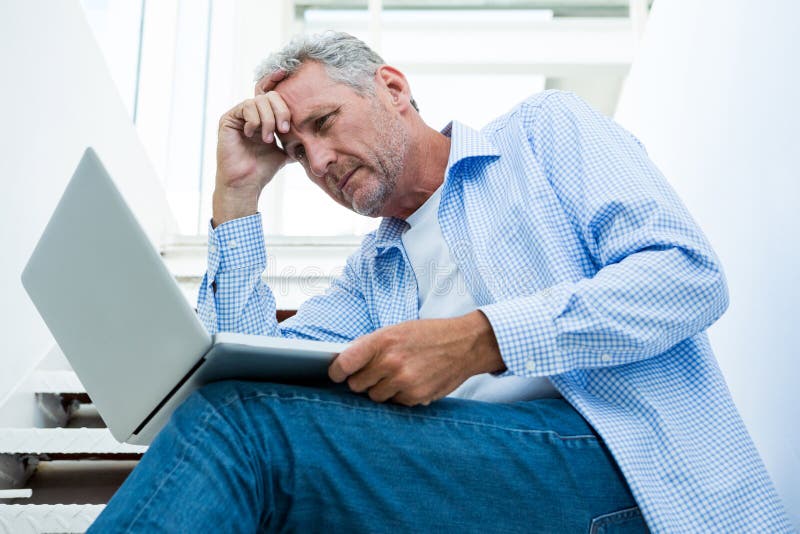 Tensed Man Using Digital Tablet on Steps Stock Photo - Image of ...