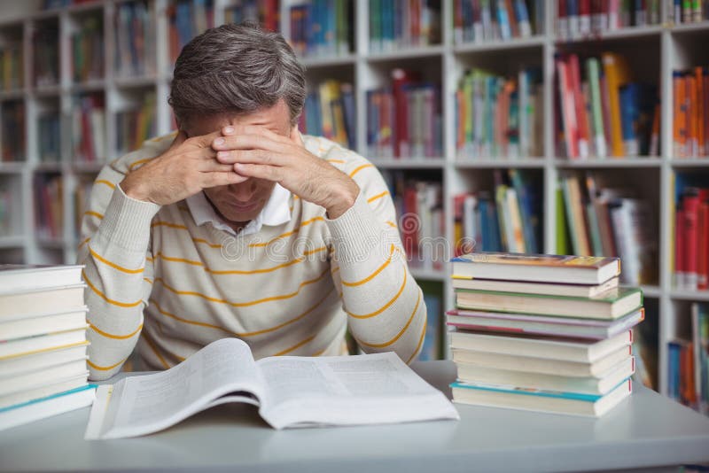Tensed School Teacher Studying in Library Stock Photo - Image of ...