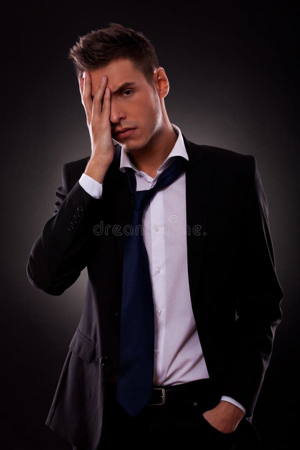Tensed young business man stock photo. Image of formal - 16492454