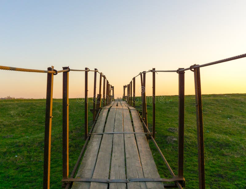 Tension Bridge Stretching into Sunset Stock Photo - Image of adventure ...