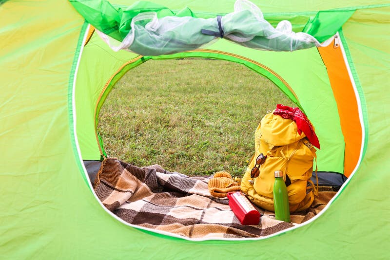 Tent, Backpack and Camping Equipment on Green Grass in Mountains Stock ...