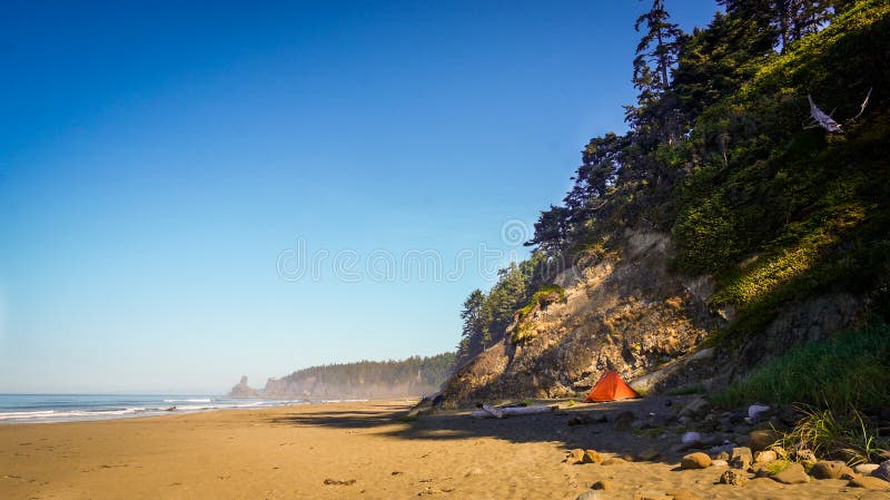 Tent at the beach by cliff stock image. Image of beach - 143737625