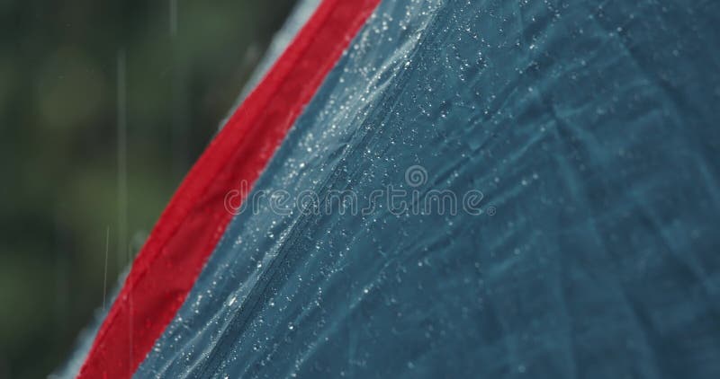 Rain falling on tents stock footage. Video of outdoor - 258665320