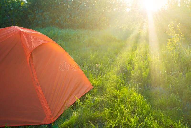 Tent camping at sunset stock image. Image of scenics - 189224503