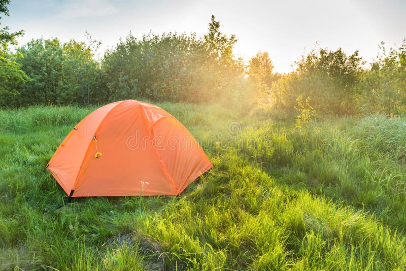 Tent camping at sunset stock image. Image of sunset - 189224673