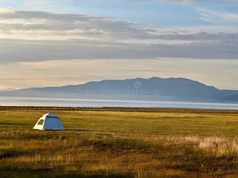 Tent in Open Field at Sunrise Stock Image - Image of water, golden ...