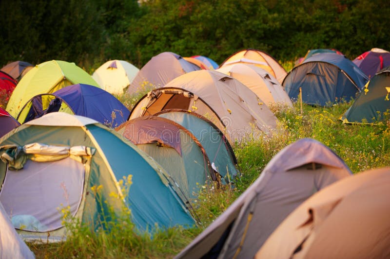 Tent town at sunset stock image. Image of campsite, tent - 106549959