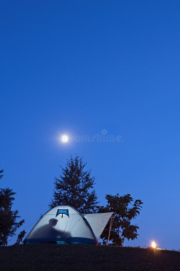 Tent in Twilight with Moon and Fire Vertical Stock Photo - Image of ...