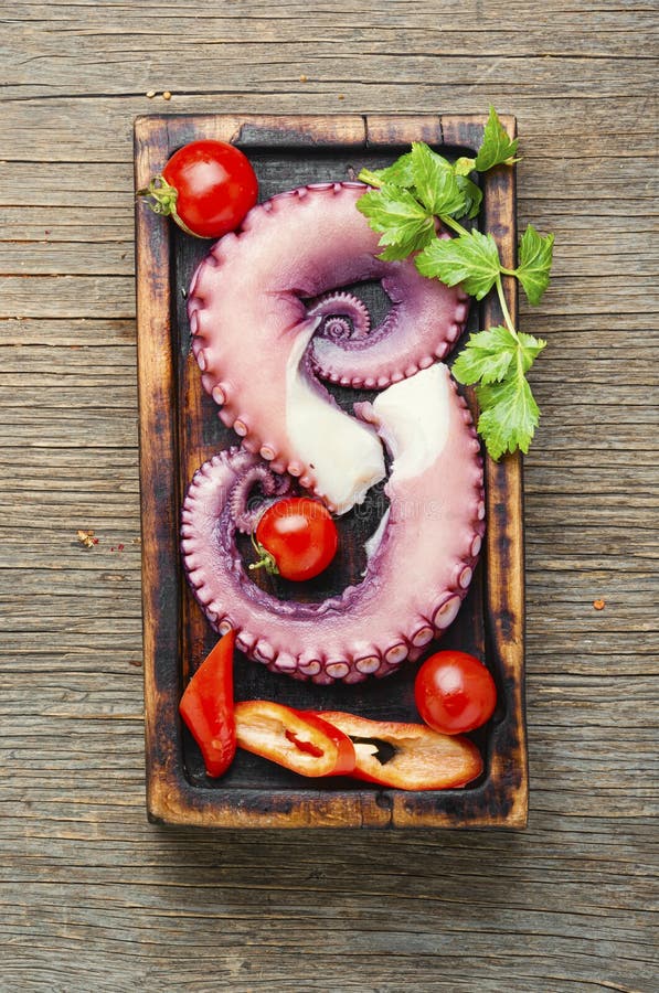Raw Octopus on Wooden Table Stock Photo - Image of delicious, cockle ...