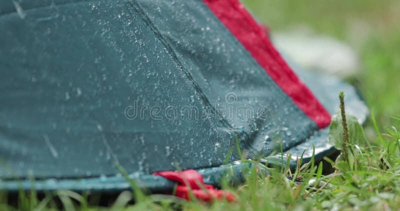 Rain falling on tents stock footage. Video of vacation - 244854520