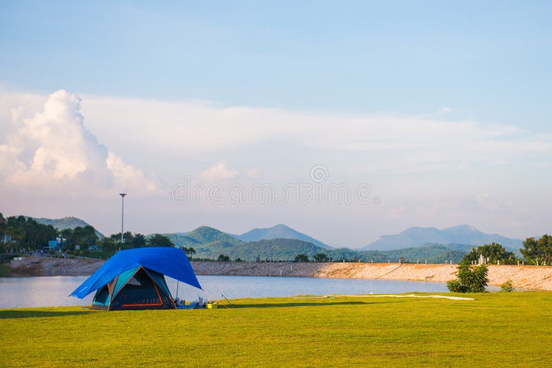 Tents Camping on Grass Field beside the River Stock Photo - Image of ...