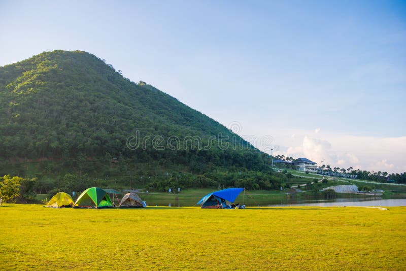 Tents Camping on Grass Field beside the River Stock Image - Image of ...