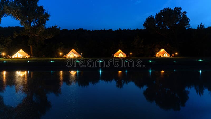 Tents at glamping, night stock photo. Image of orange - 251022900