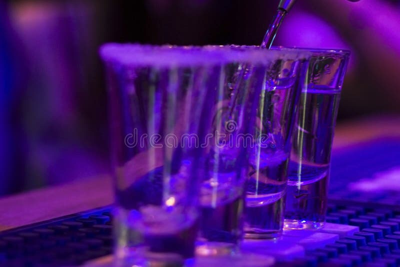 Tequila Shots on the Bar Table, Blue Light and Nightlife Situation in ...