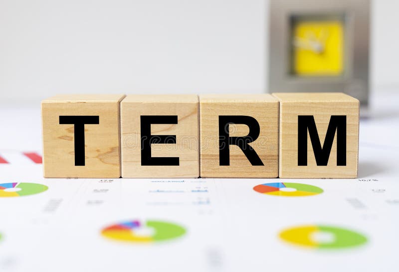 TERM Word on Wooden Cube Blocks on Colorful Charts Documents with Clock ...