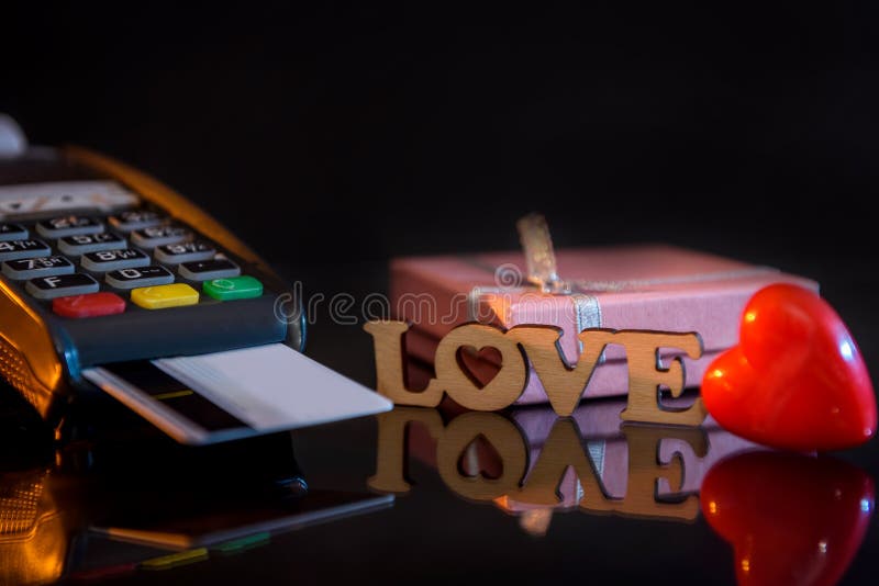 Terminal with Credit Card and Gift Box with Love Text Stock Image ...