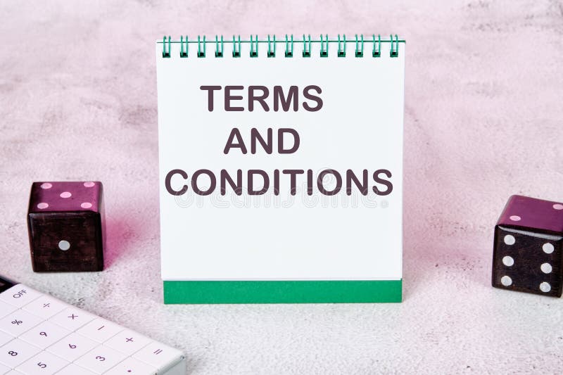 TERMS and CONDITIONS Text on a White Notepad Sheet Next To Dice on an ...
