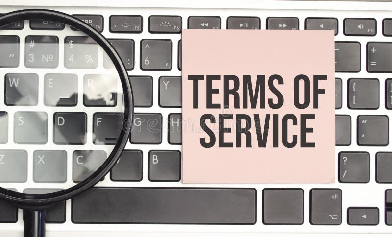 Terms of Service Words on Pink Sticker and Magnifier on Laptop Stock ...