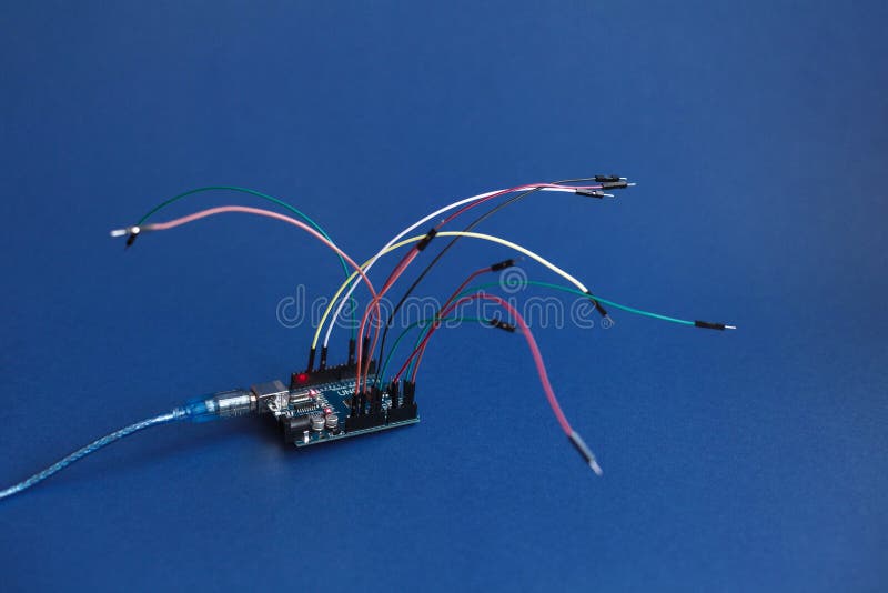 Blue Arduino Uno Board Electronics in Hand for Programming the Microcontroller Editorial Image ...
