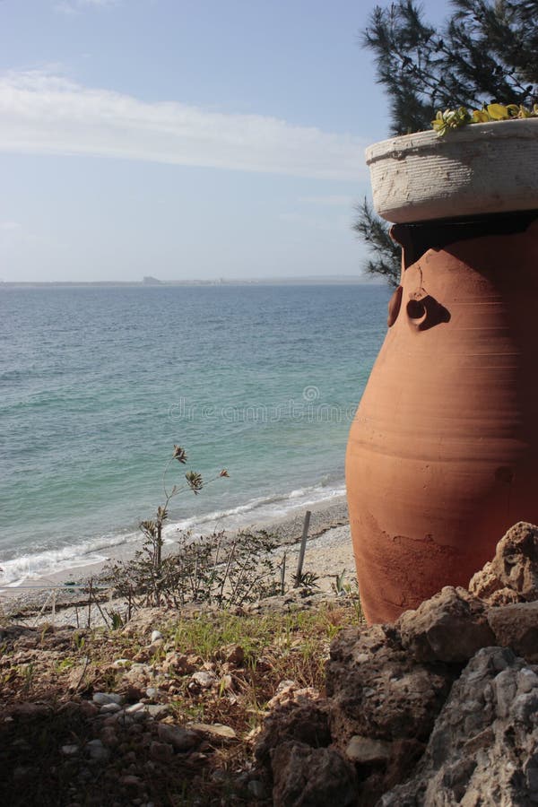 Terra Cotta Pottery Standing Across from the Beach Stock Image - Image ...