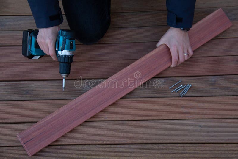 Terrace Deck Construction, Carpenter Holding Tools and Ipe Timber Board ...