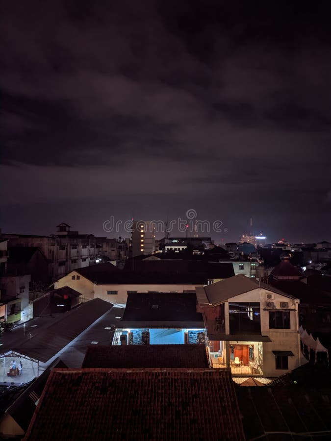 A terrace house at night stock image. Image of skyline - 262475803