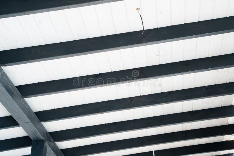 Terrace Made of Wood with White Lining and Black Rafters. Stylish ...