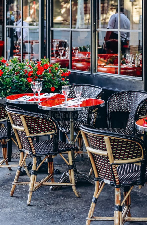 Terrace of a Parisian Restaurant with Red Tables and Red Flowers Stock ...