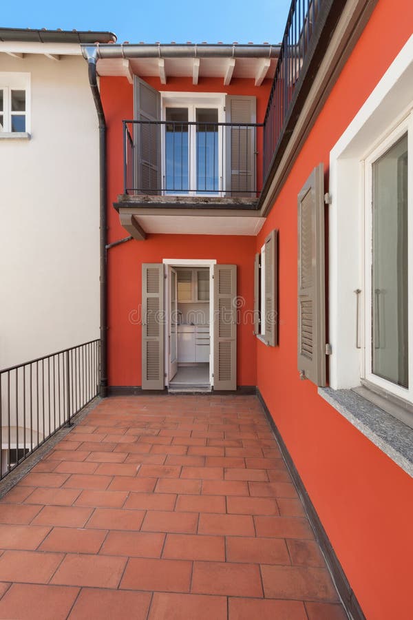 Terrace of a red house stock image. Image of europe, terrace - 71044101