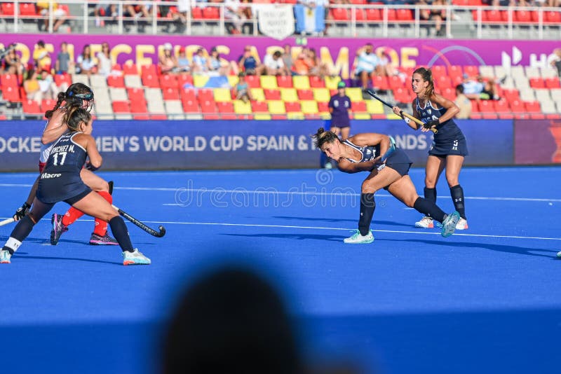Players In Action In The Argentina Vs Canada Field Hockey Match At The