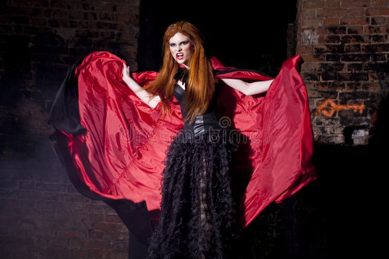 Terrible Vampire Woman in Red Cloak Stock Photo - Image of hair, long ...