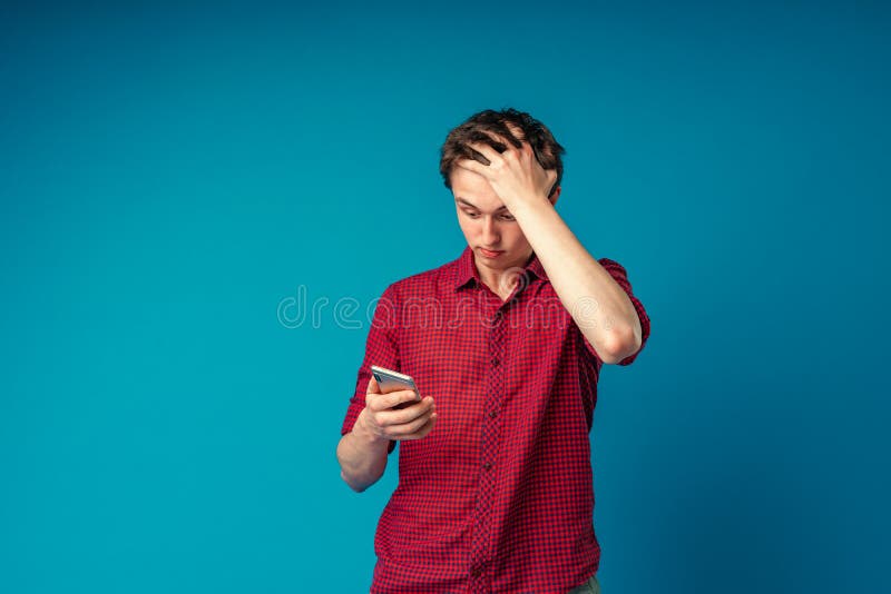 Terrified Young Man Covers His Face with His Hand in Shock at the ...