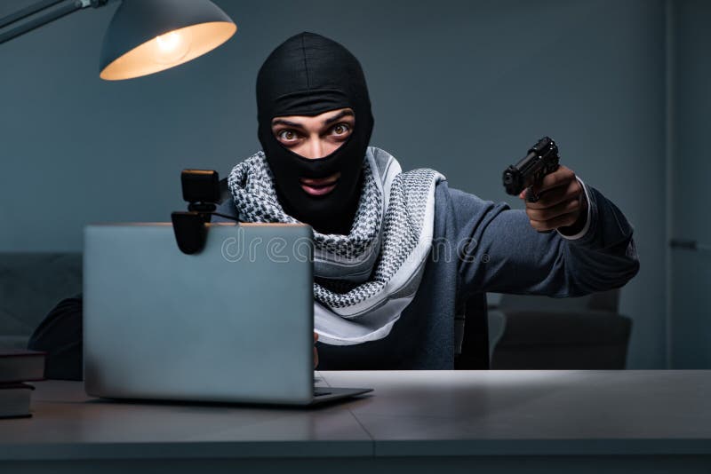 The Terrorist Burglar with Gun Working at Computer Stock Photo - Image ...