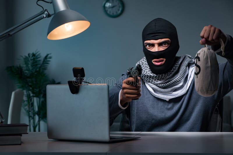 The Terrorist Burglar with Gun Working at Computer Stock Photo - Image ...
