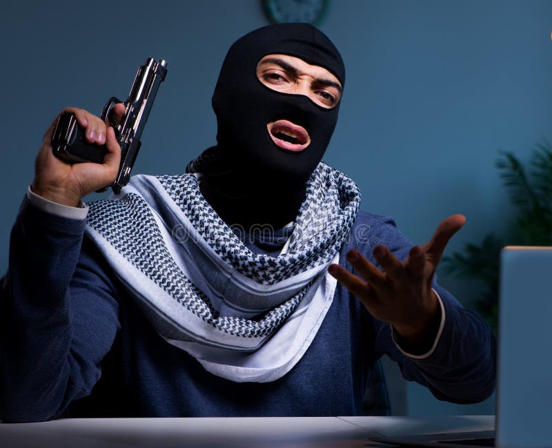 Terrorist Burglar with Gun Working at Computer Stock Photo - Image of ...