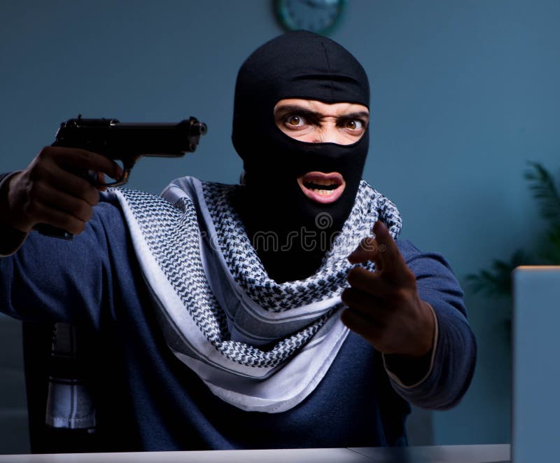 Terrorist Burglar with Gun Working at Computer Stock Photo - Image of ...